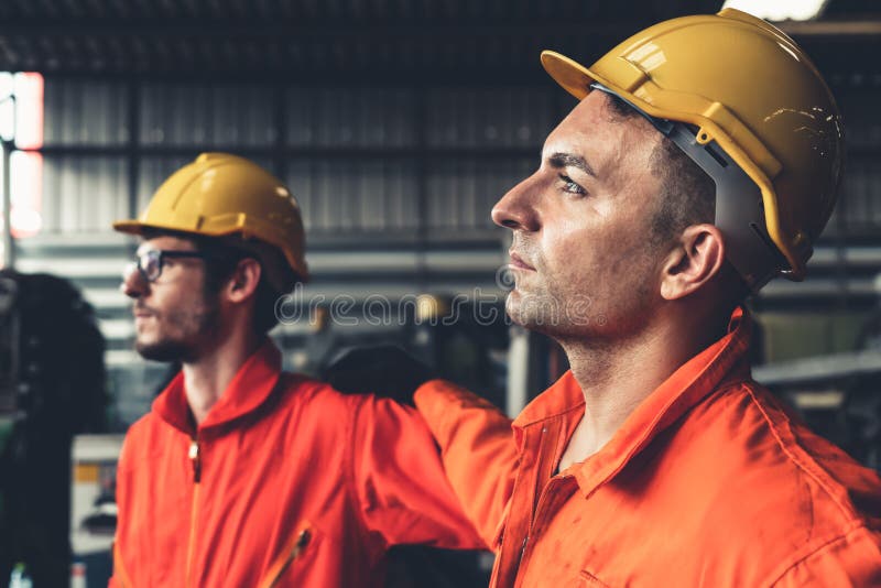 Two Skillful Factory Engineer or Worker Showing Teamwork and ...