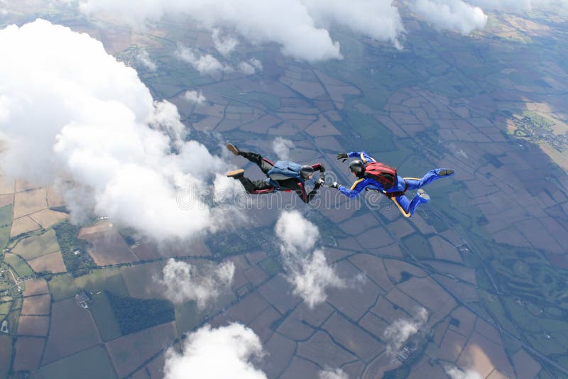 Two skydivers in freefall stock photo. Image of extreme - 21231418