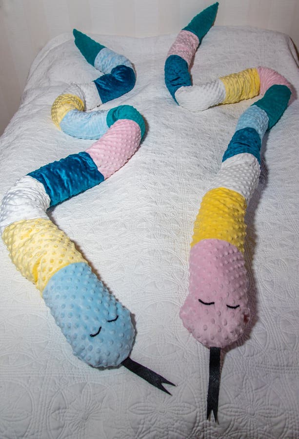 Two Sleeping Snakes Lying in Bed Stock Image - Image of pink, stich ...