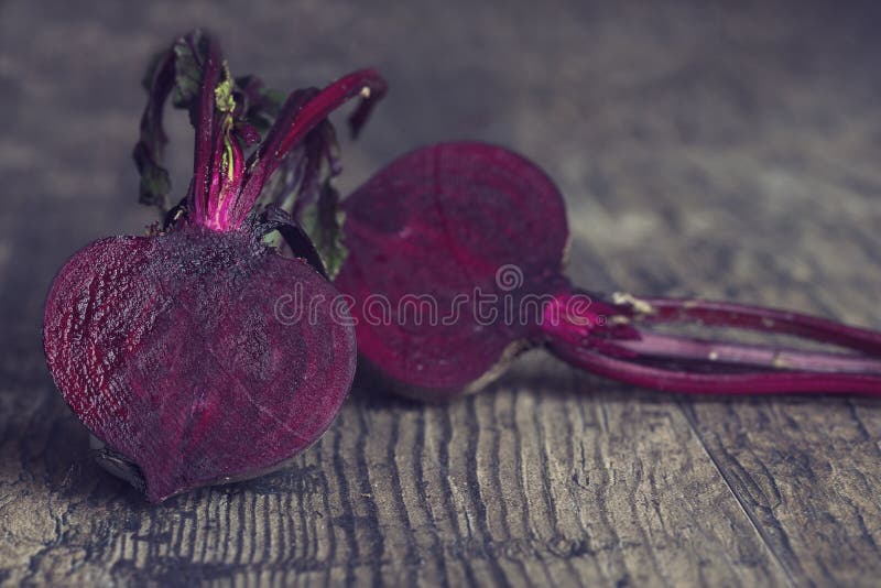 Two Sliced Beetroot on a Brown Wooden Table in Artistic Conversion ...