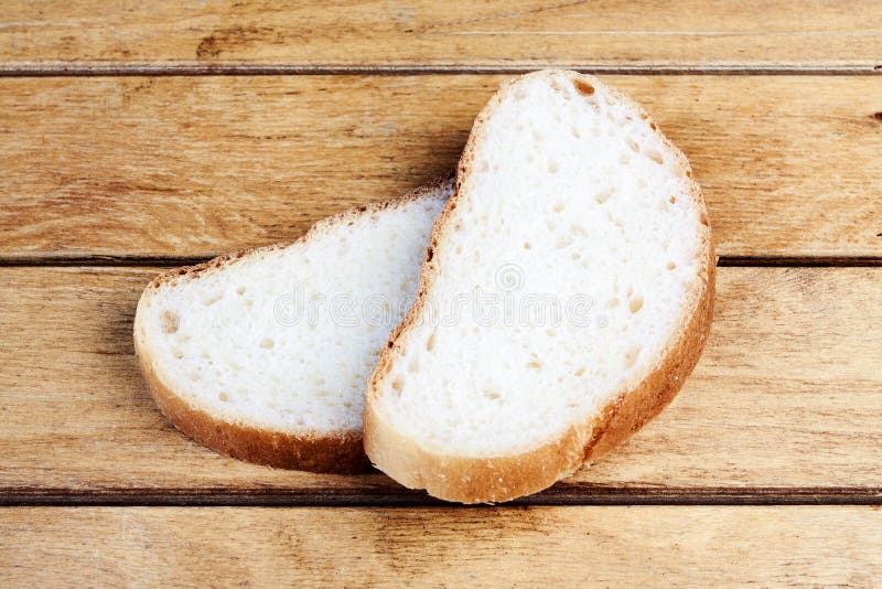 Two slices of bread stock photo. Image of closeup, wooden - 41470364