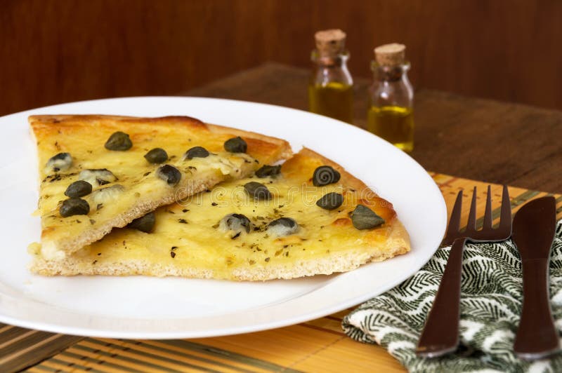 Two slices of caper pizza stock image. Image of mediterranean - 245669499