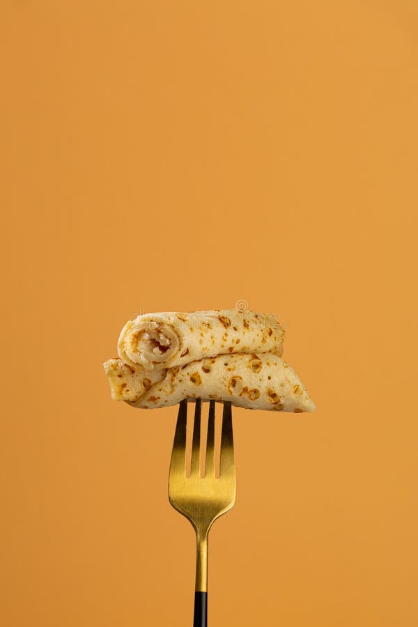 Two Slices of Thin Pancakes on a Fork Food Background Stock Image ...