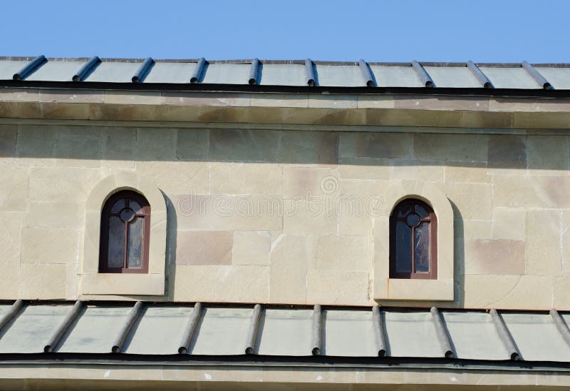 Two Small Arched Windows Under the Roof Stock Image - Image of backdrop ...