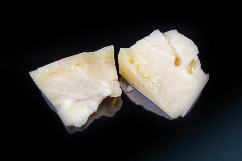 Broken Pieces of Hard Cheese on Dark Surface, Top View Stock Image ...