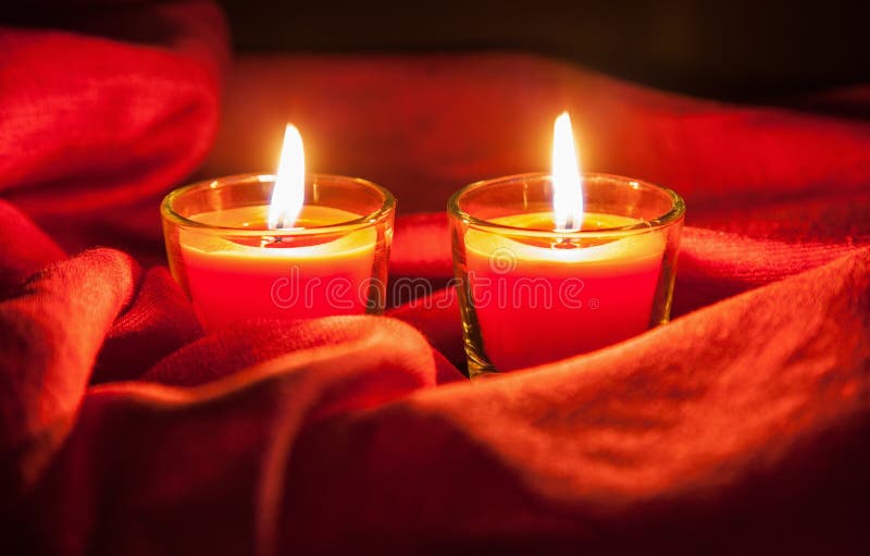 Two small burning candles stock image. Image of decoration - 44511923