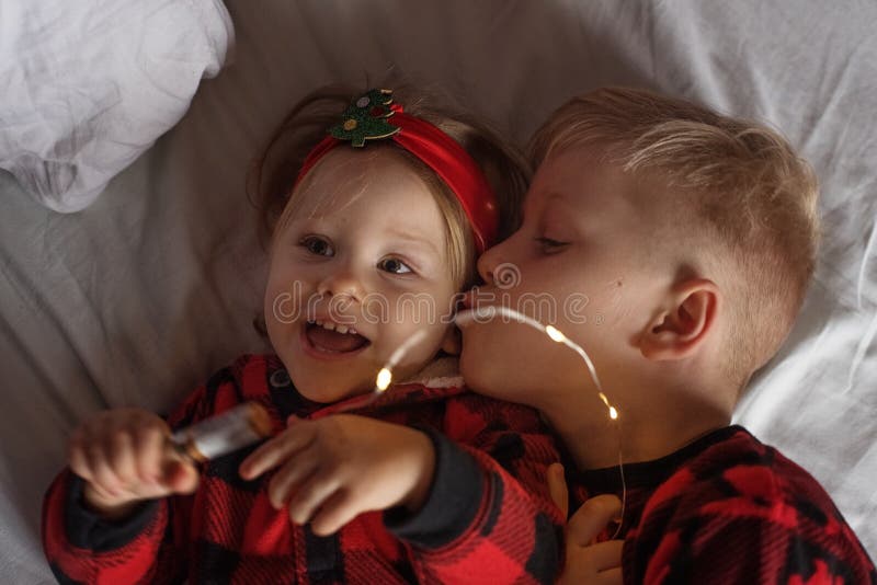 Two Small Children are Lying on the Bed and Having Fun. Preparation for ...