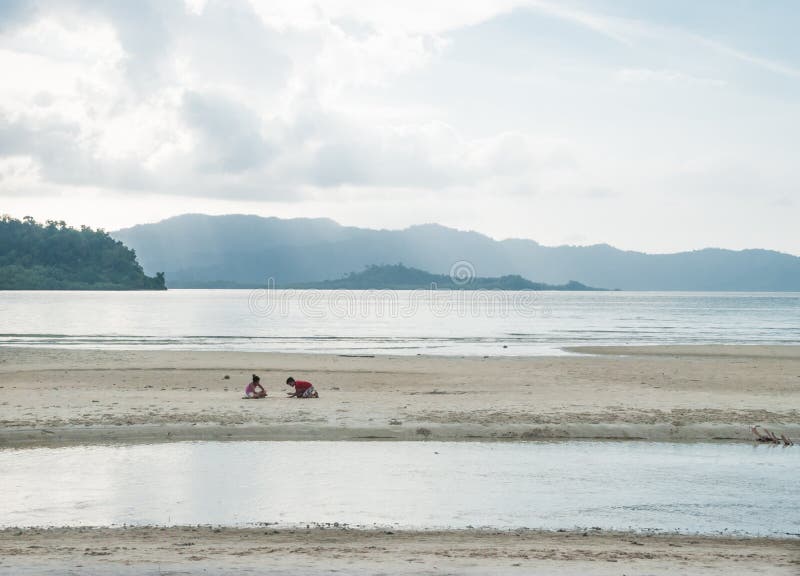 Two Small Children Playing on the Beach Stock Photo - Image of sand ...