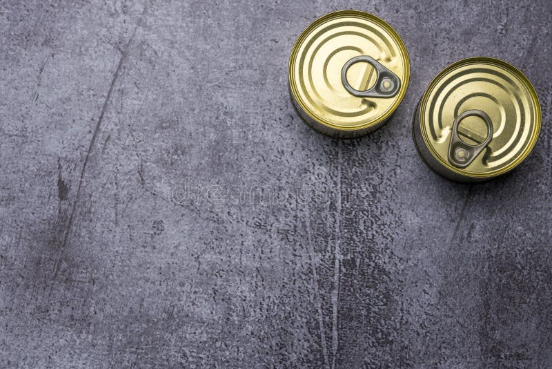 Two Small Circular Tin Cans Closed with Easy-open Rings on Gray Surface ...