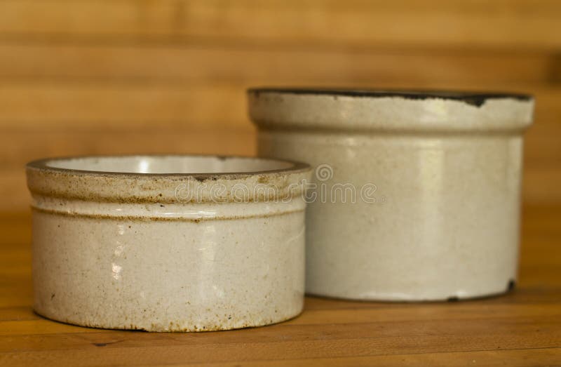 Two Small Clay Crocks on Butcher Board Table. Stock Image - Image of ...