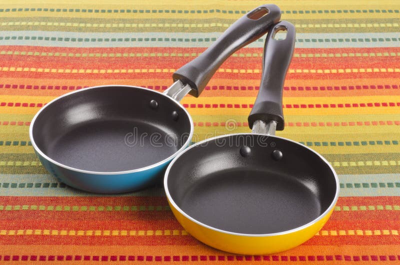 Two Small Frying Pans #1 stock image. Image of cloth - 28384875