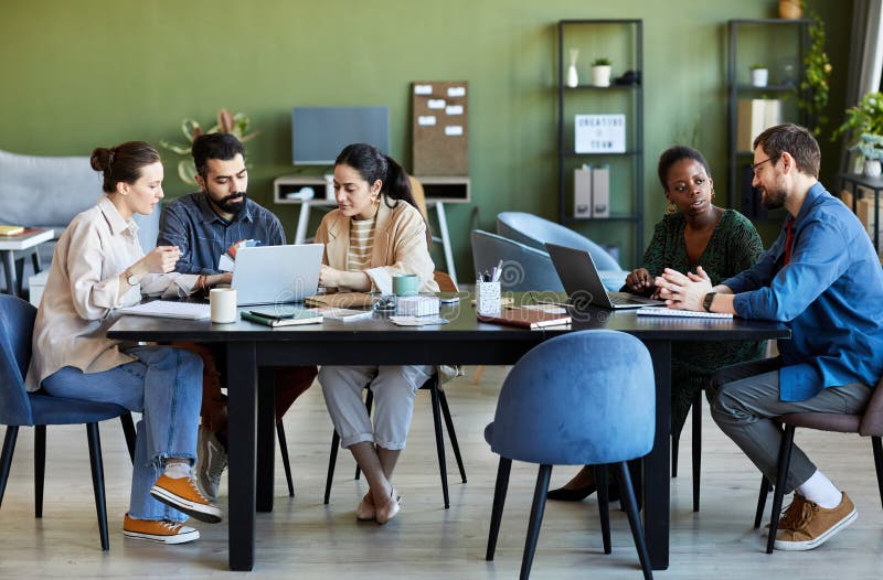 Two Small Groups of Modern Creative Designers Discussing Working Points ...