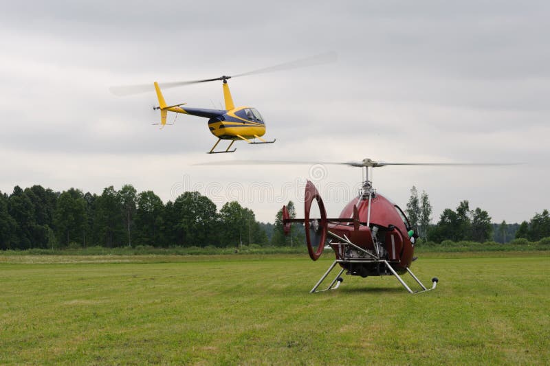 Two Small Helicopters Take Off Stock Image - Image of airship, flight ...