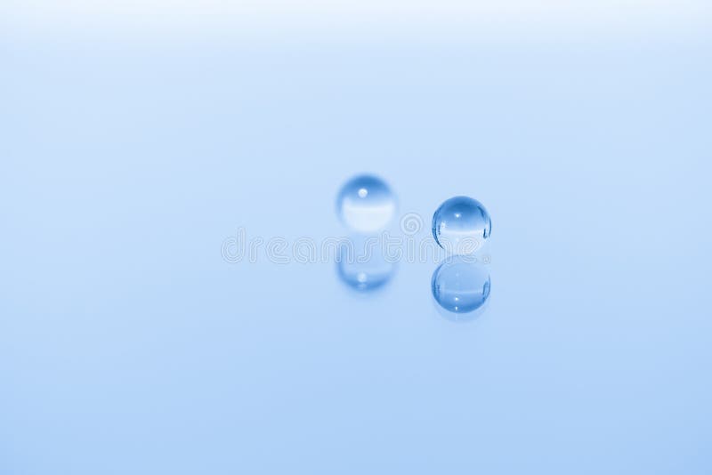 Two Small Marbles on a Glossy Celestial Background. Stock Photo - Image ...
