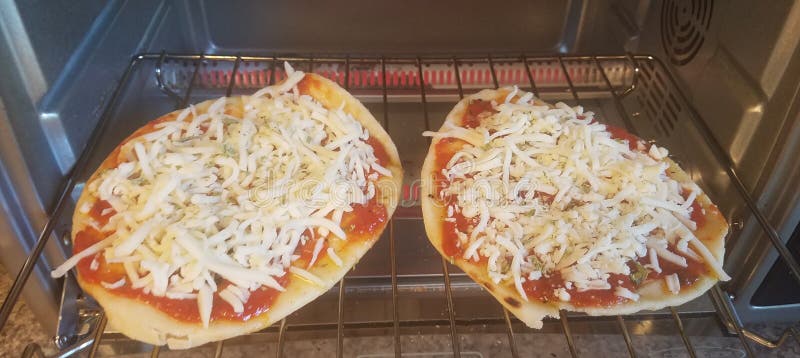 Two Small Pizzas Cooking in a Toaster Oven Stock Image - Image of oven ...