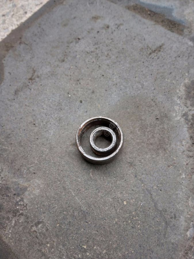 Two Small Spare Parts Resting on Each Other Stock Photo - Image of iron ...