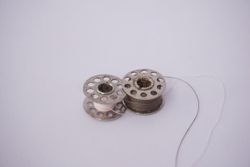 Two Small Spools of Sewing Thread of Various Colors Isolated on a White ...