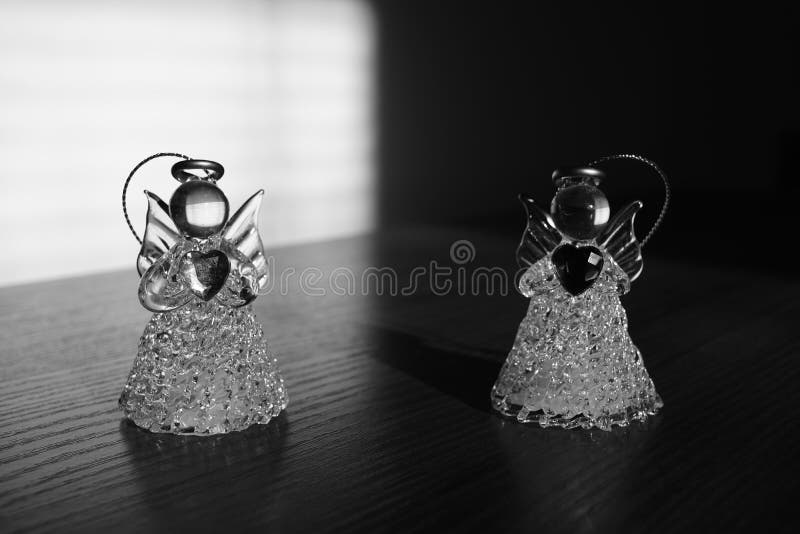 Two Small Statues of Angels on the Table, Light with Shadow, Black and ...