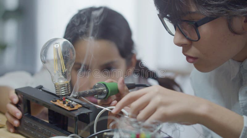 Two Smart Kids Practicing Their Hobby in Electrical Engineering Stock ...
