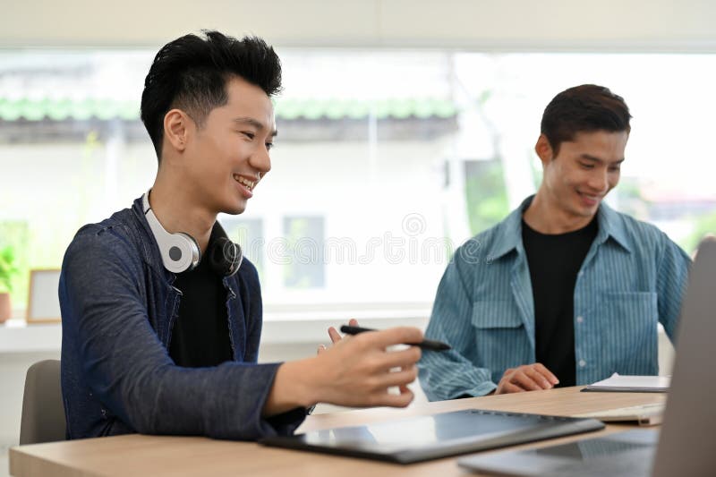 Two Smart Millennial Asian Male Web Developers Discussing and Working ...