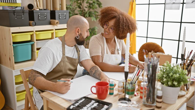 Two Smiling Artists, Confidently Drawing on Paper in Art Studio ...