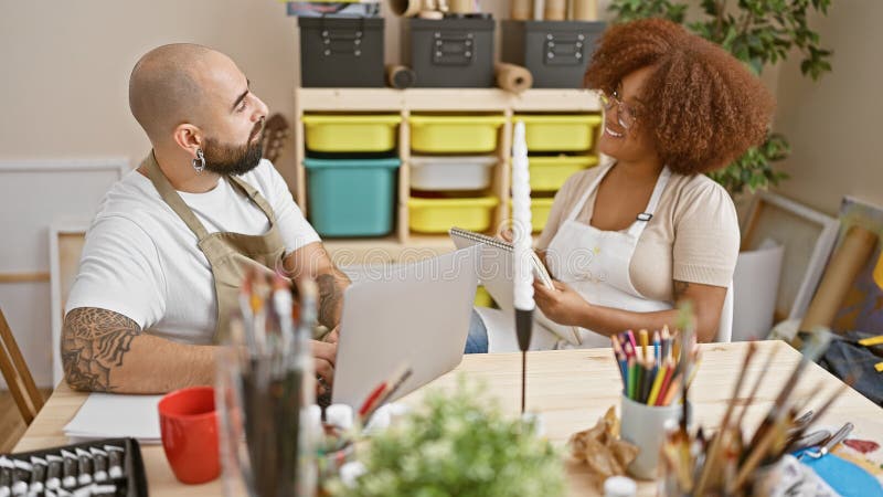 Two Smiling Artists Confidently Drawing Together on a Laptop in Their ...