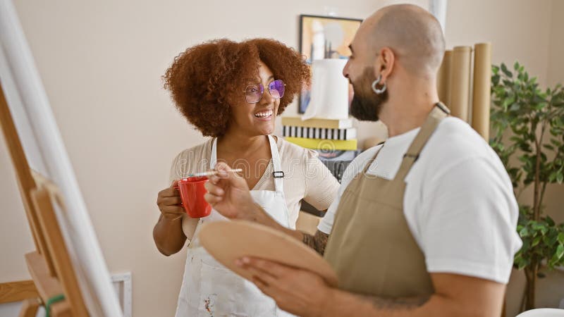 Two Smiling Artists Confidently Sipping Coffee while Drawing in a ...