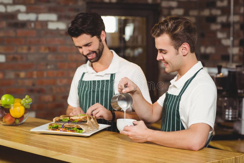 Two Smiling Baristas Working at the Counter Stock Image - Image of ...