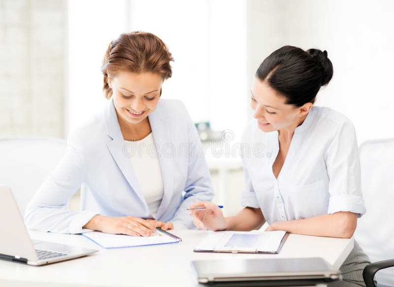 Two Smiling Businesswomen Working in Office Stock Photo - Image of ...