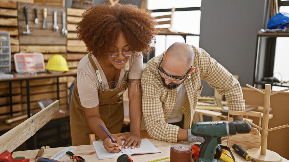 Two Smiling Carpenters Confidently Taking Notes in Their Woodworking ...