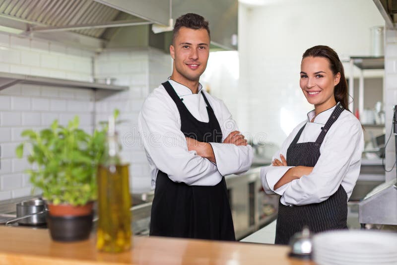 Two Smiling Chefs in Kitchen Stock Photo - Image of female, ingredient ...