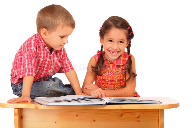 Two Smiling Children Reading the Book on the Desk Stock Image - Image ...