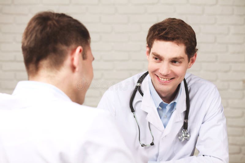 Two Smiling Doctors Discussing Something Stock Photo - Image of ...