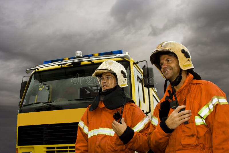 Two smiling firemen stock image. Image of courage, persons - 7958899