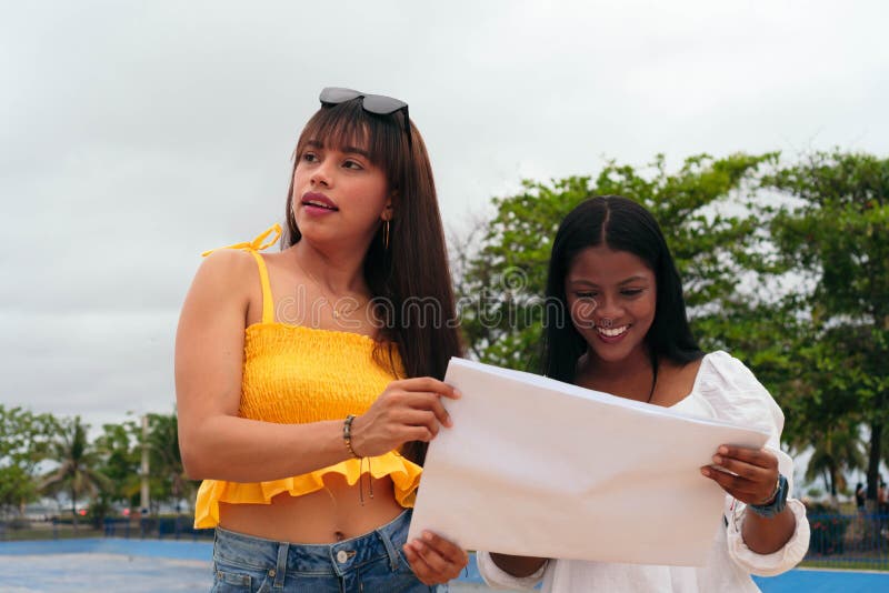 Two Smiling Friends with a Map in the Open Air Stock Image - Image of ...