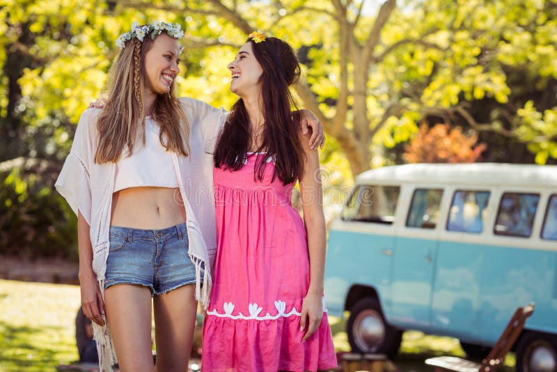 Two Smiling Friends Standing Together Stock Photo - Image of parkland ...