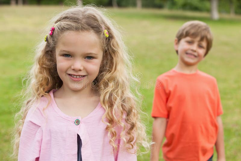 Two Smiling Kids Standing at Park Stock Photo - Image of friendship ...