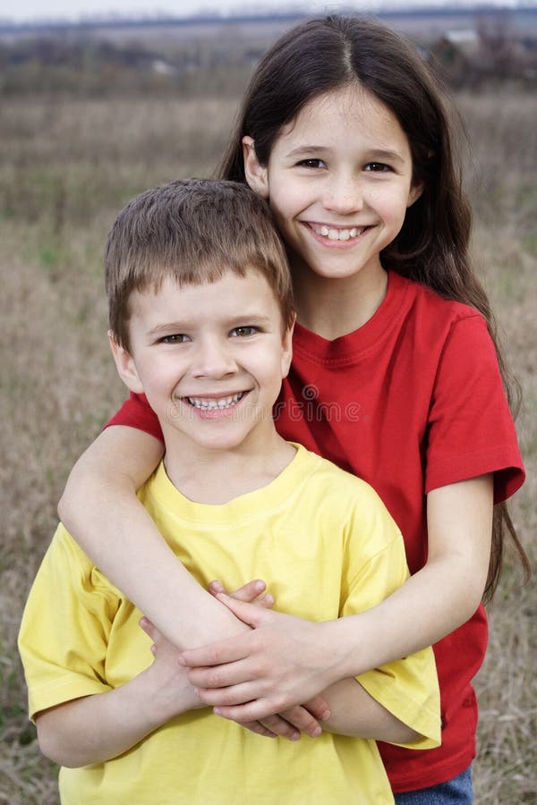 Two Smiling Kids Standing Together Stock Image - Image of little ...