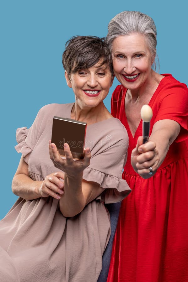 Two Smiling Ladies Doing Make Up and Feeling Enjoyed Stock Image ...