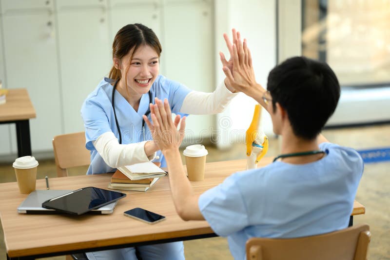 Two Cheerful College Students Celebrating Success Together. Friendship ...