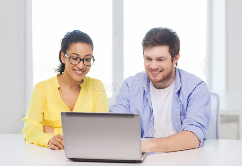 Two Smiling People with Laptop in Office Stock Photo - Image of ...