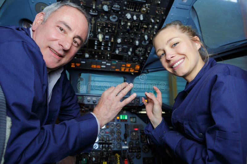 Two Smiling Pilots in Cockpit Stock Photo - Image of plane ...