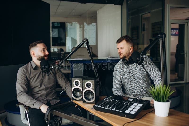 Two Smiling Radio Hosts Talking while Recording Podcast in Broadcasting ...