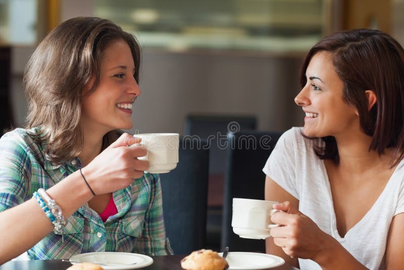 Two Smiling Students Having a Cup of Coffee Stock Image - Image of ...
