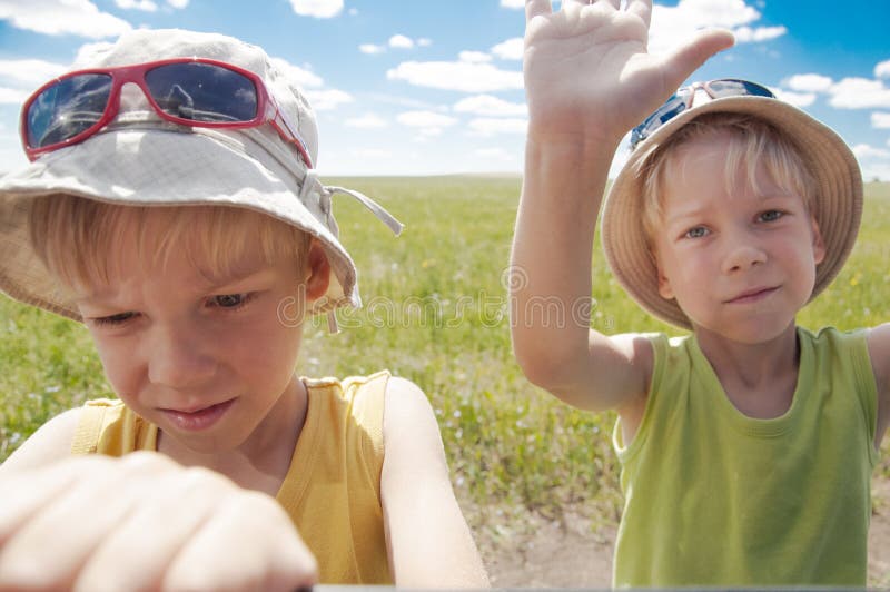 Two smiling twin brothers stock photo. Image of baby - 61437480