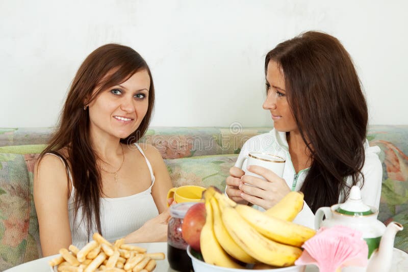 Two smiling women have tea stock image. Image of smile - 22193653
