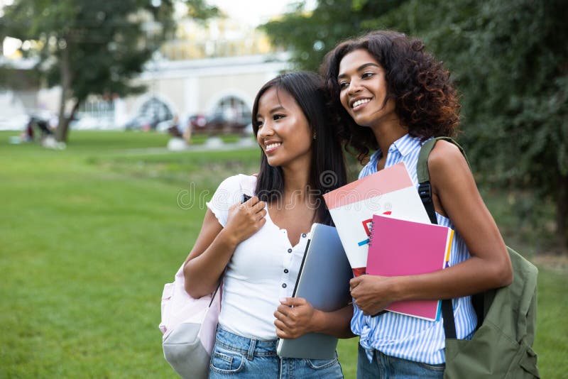 Two Smiling Young Girls Students Standing Outdoors Stock Image - Image ...