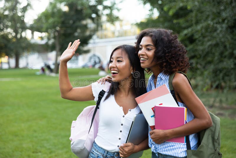 Two Smiling Young Girls Students Standing Outdoors Stock Image - Image ...