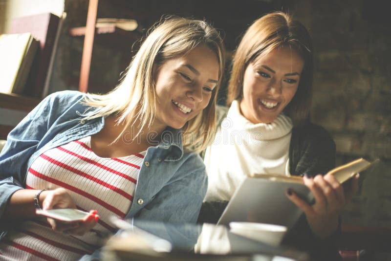 Smiling Young Students Girls Learning and Using Smart Phone. Stock ...