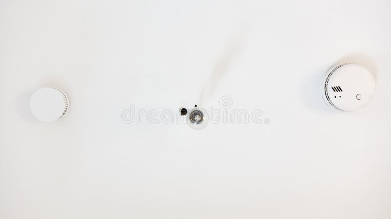 Two Smoke Detectors are Installed on the Ceiling in a Residential ...